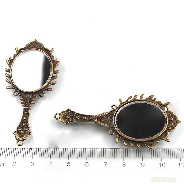 Two Vintage Bronze Mirror Pendants on Luulla